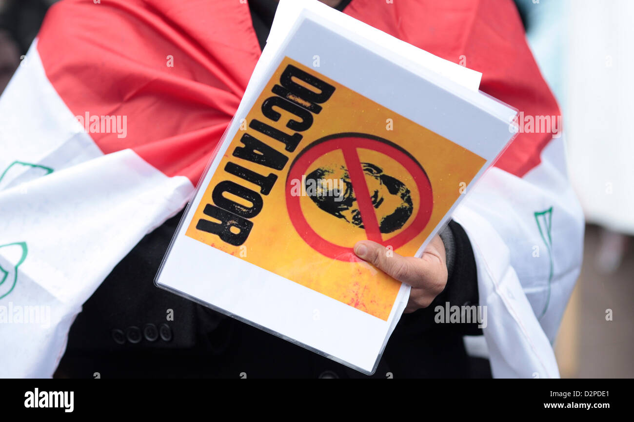 "Dictator" sign held by a demonstrator at the demonstration against the ...