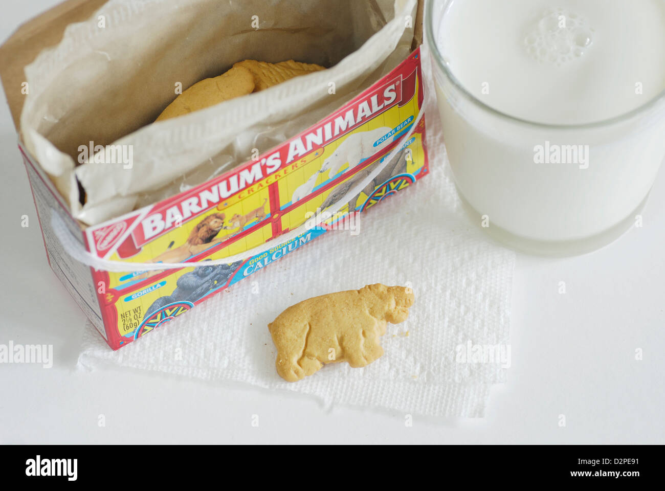 Animal Crackers with Box and glass of cows milk, hippo placed on ...