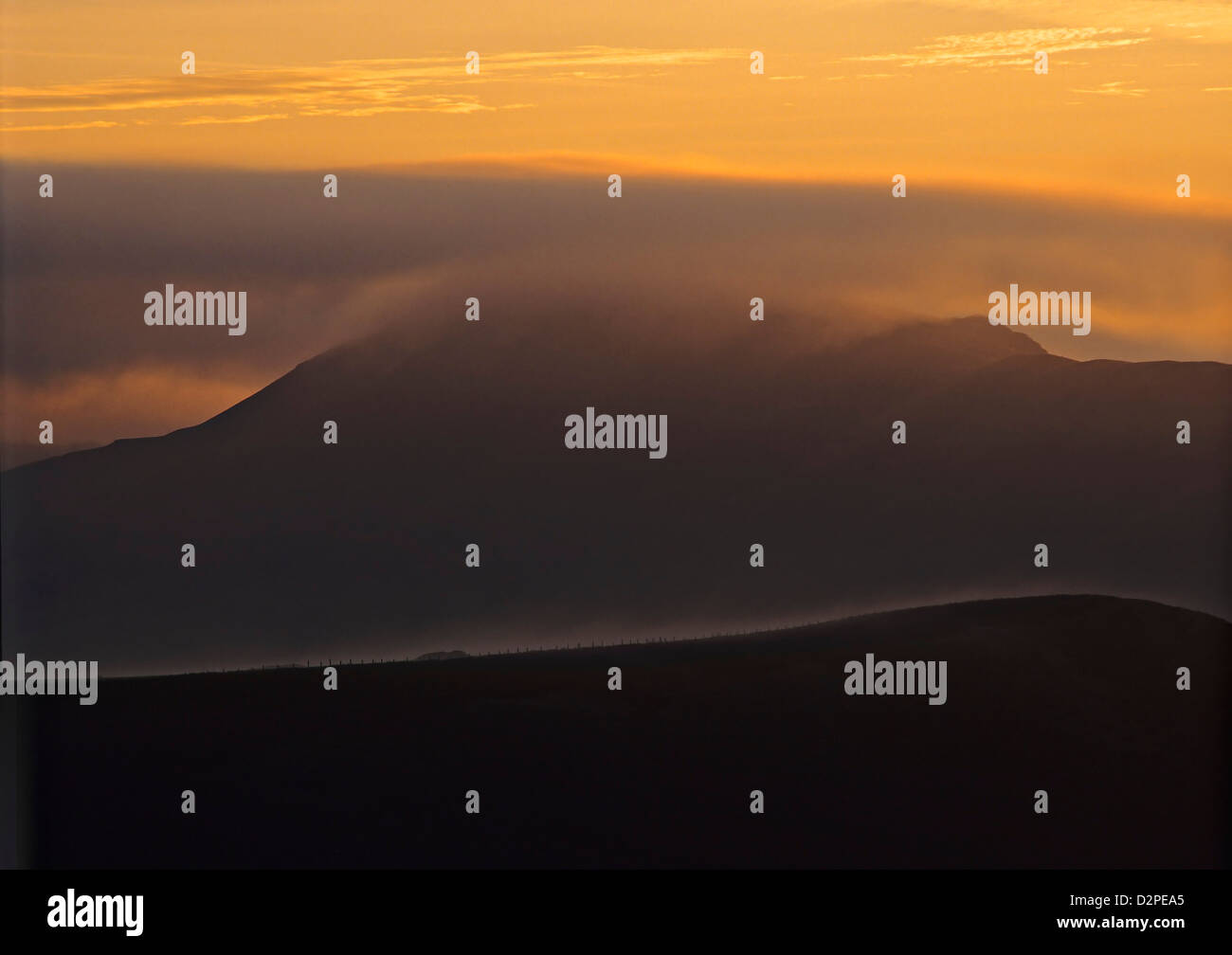 Misty dawn over Caer Caradoc in the Shropshire hills, England Stock ...