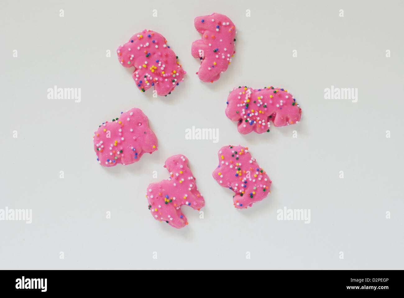 Pink Frosted Animal Cookies with Sprinkles on white background Stock ...