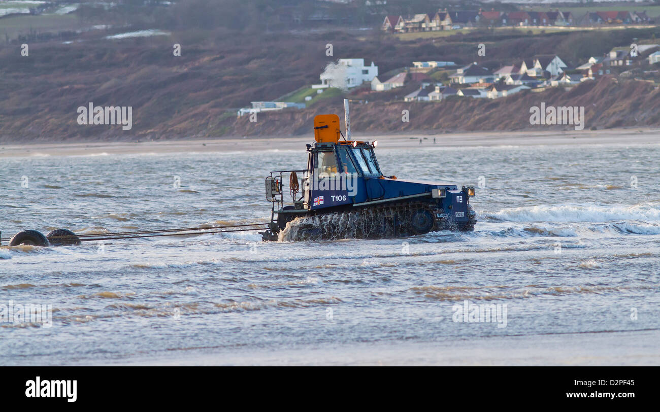 the filey lifeboat tractor is been put into action Stock Photo - Alamy