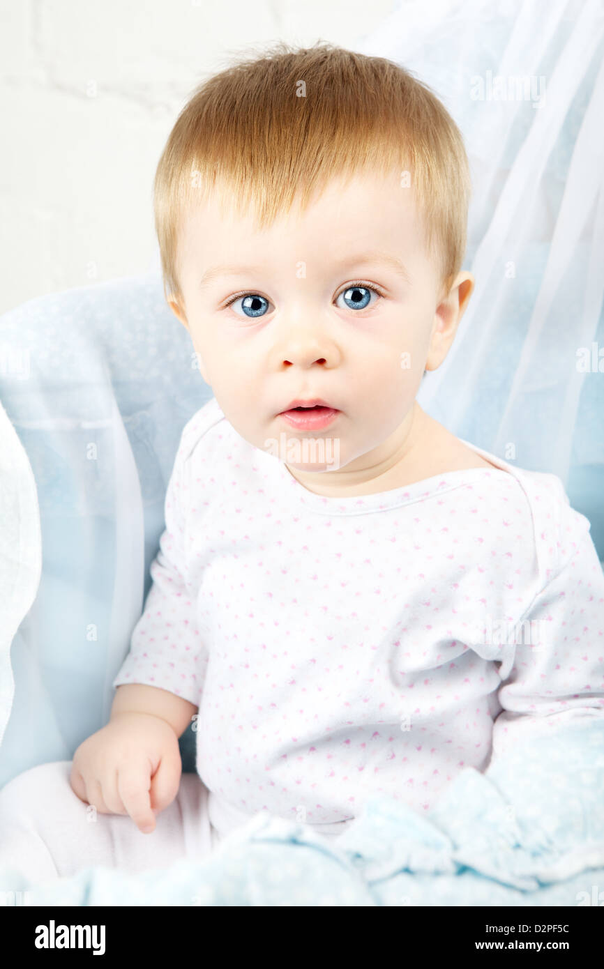 funny baby in cradle, happy and smiling Stock Photo - Alamy