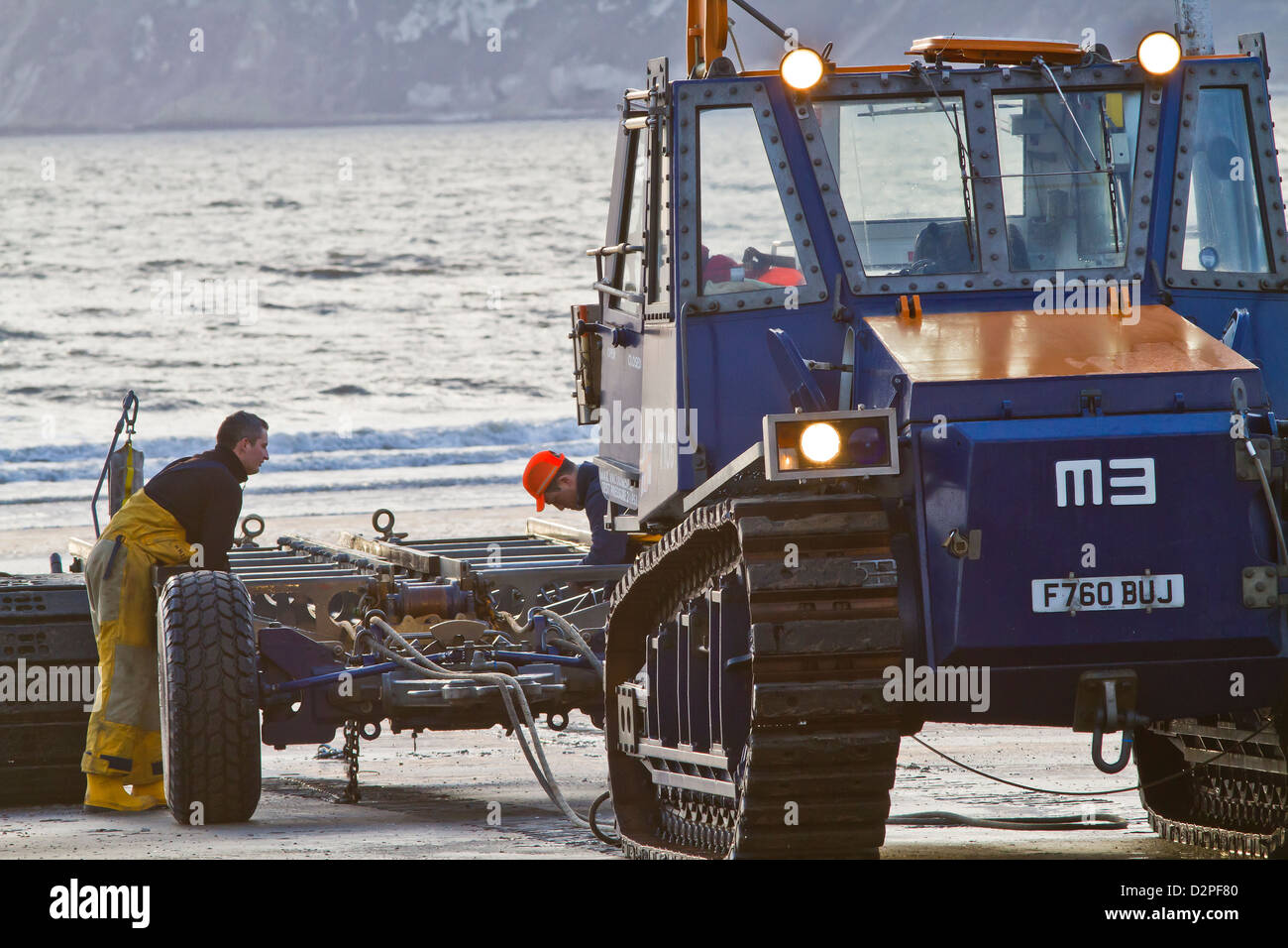 the filey lifeboat tractor is been put into action Stock Photo - Alamy
