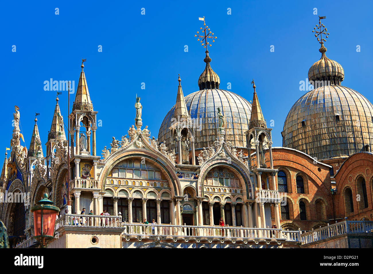 Facade with Gothic architecture and Romanesque domes of St Mark's ...