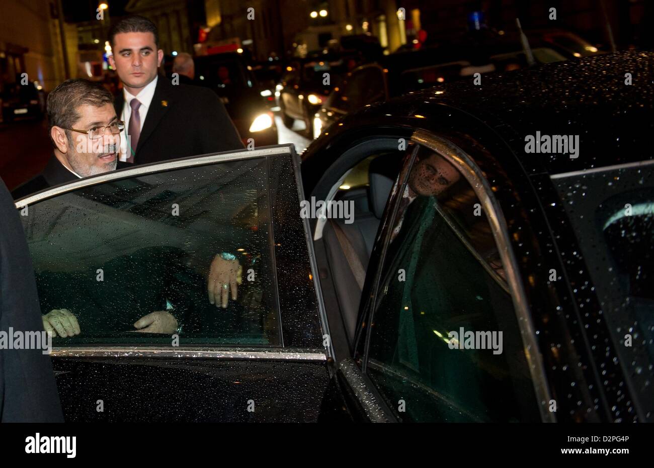Egyptian President Mohammed Mursi steps into his car after attending an ...