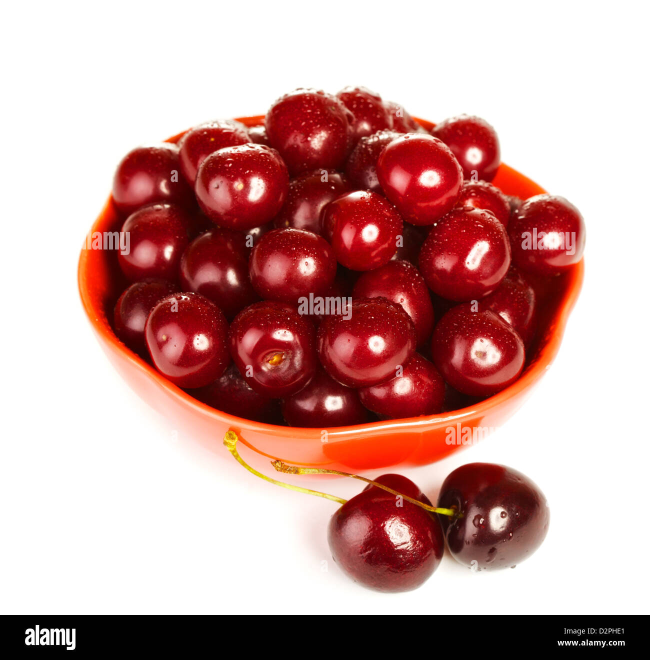 bowl full of cherries isolated on white background Stock Photo - Alamy