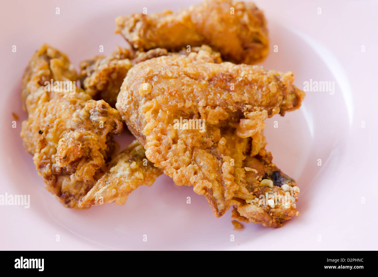 deep fried chicken on pink dish Stock Photo - Alamy