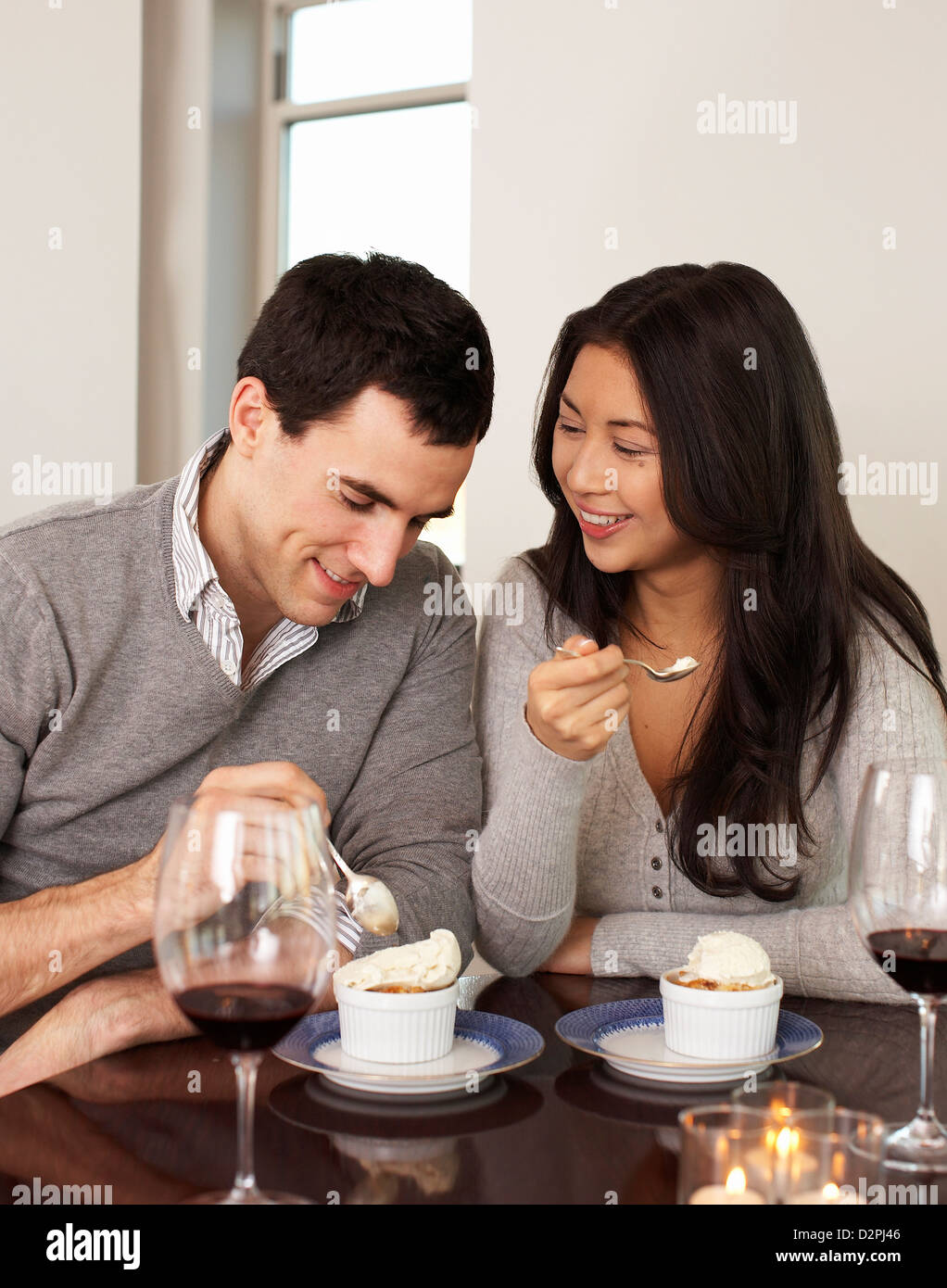 Couple eating dessert together Stock Photo - Alamy
