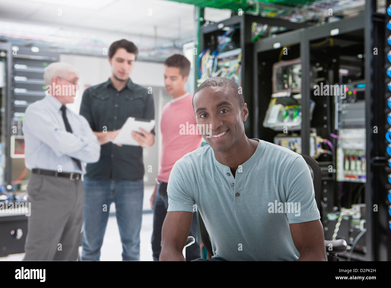 Businessmen in server room Stock Photo - Alamy