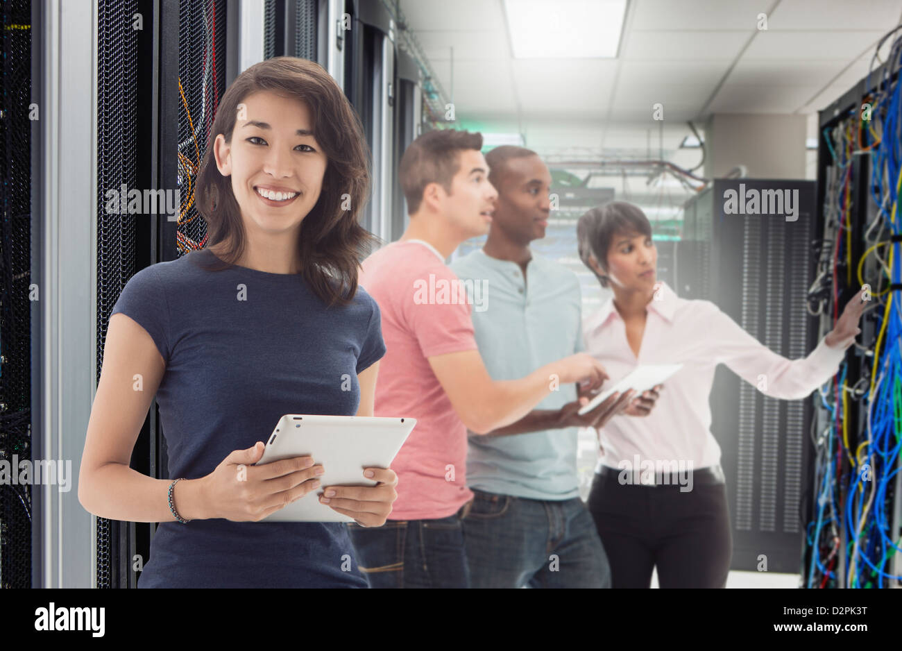 Business people standing in server room Stock Photo - Alamy