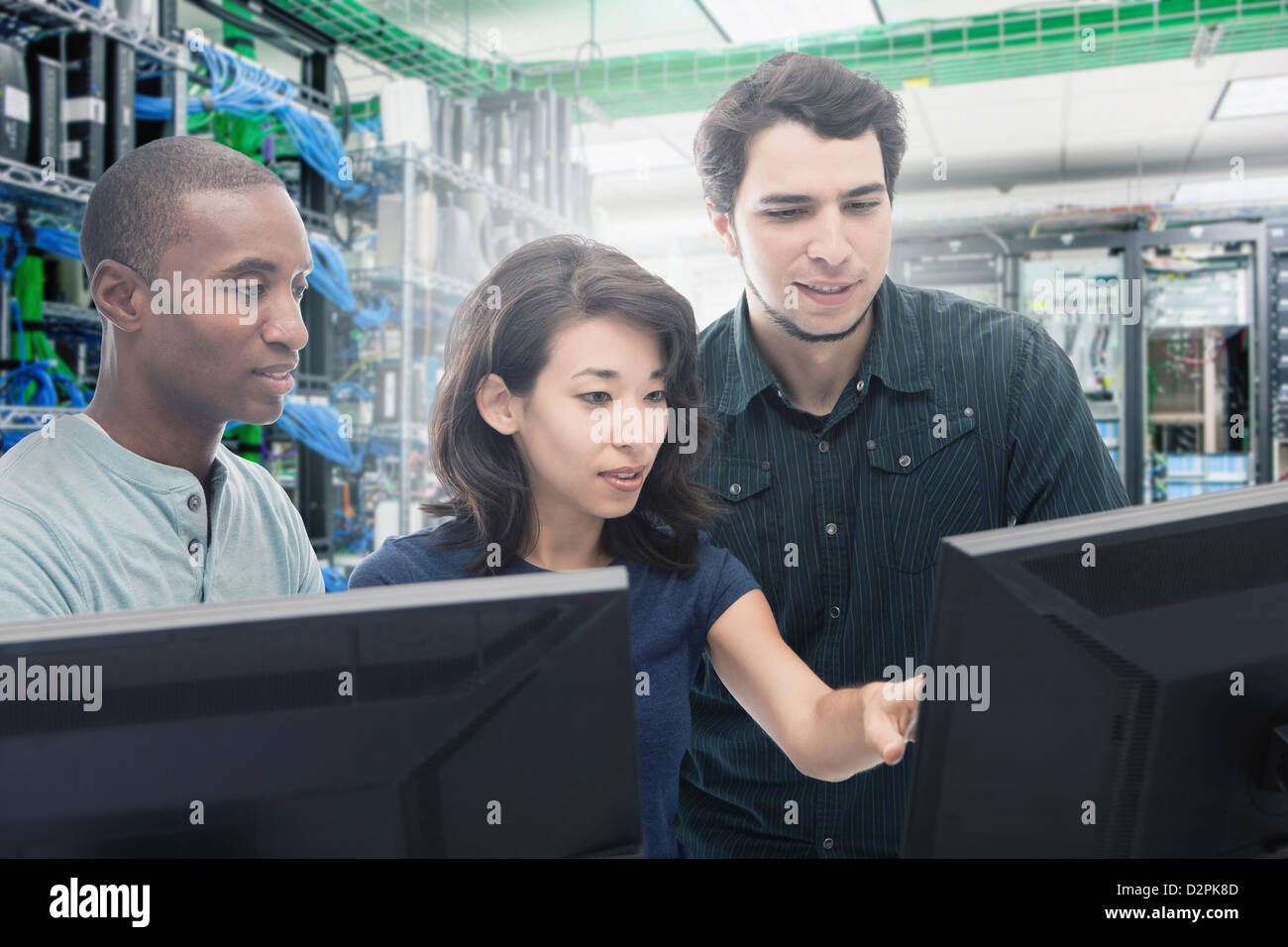 Business people working in server room Stock Photo - Alamy