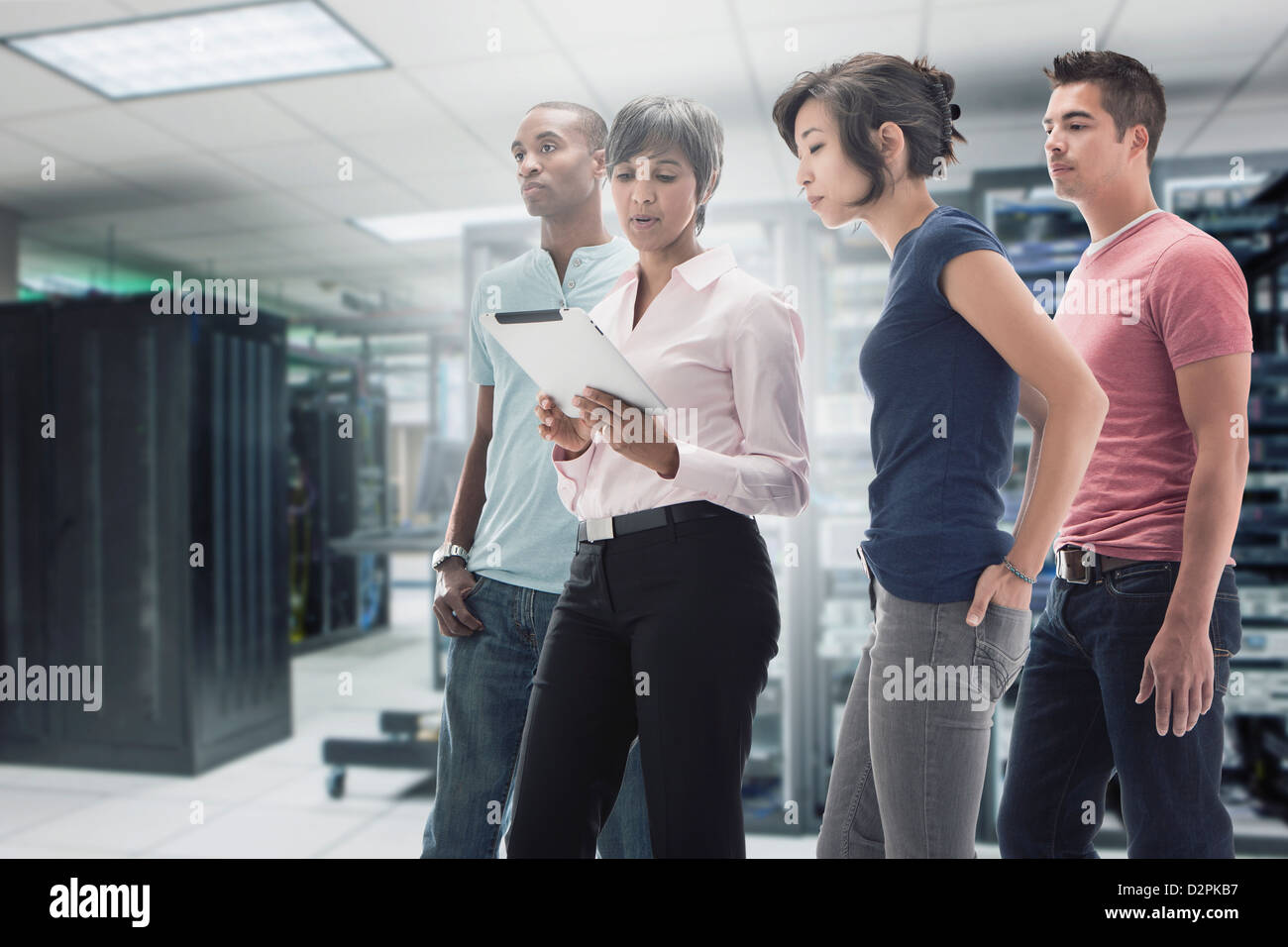 Business people working in server room Stock Photo - Alamy