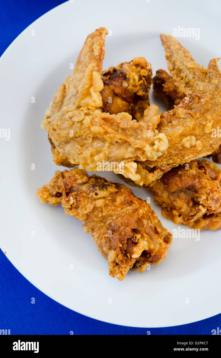 top view deep fried chicken on dish , blue background Stock Photo - Alamy