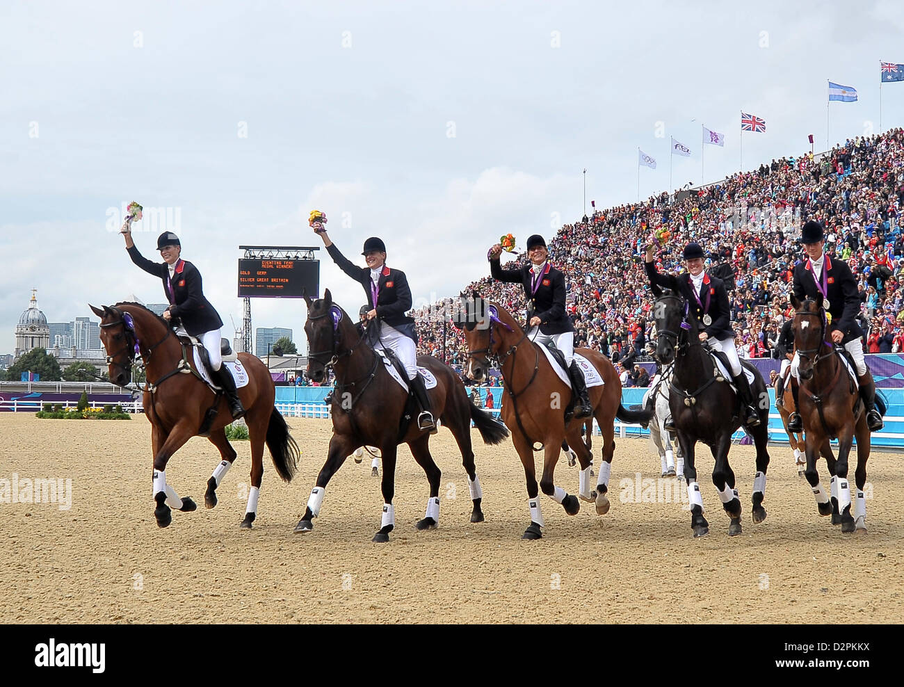 The British team celebrate with a lap of honour. Equestrian Eventing ...