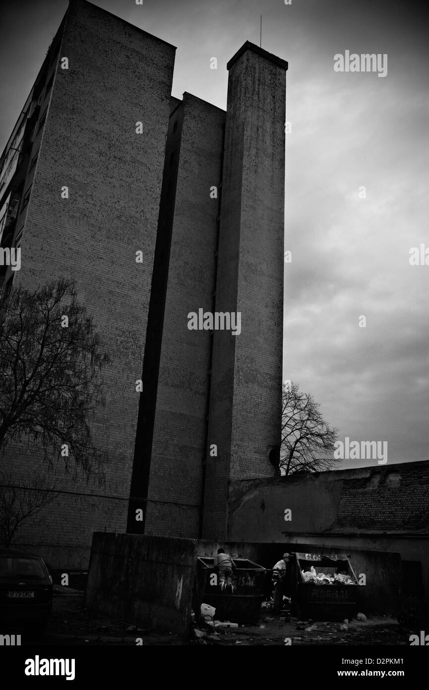 Dumpster hunt, young boy and old man searching through the trash to ...