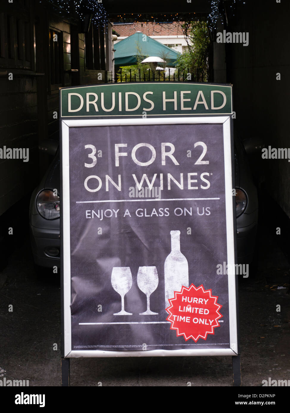 Pub sign offering three glasses of wine for two on special offer Stock ...