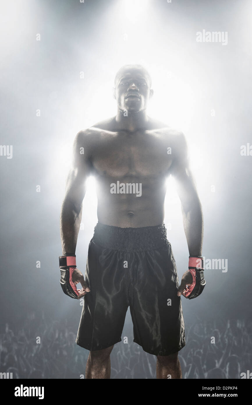 Light shining from behind African American MMA boxer Stock Photo - Alamy