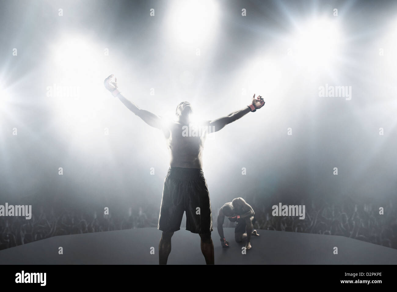 Light shining from behind winning African American MMA boxer Stock ...