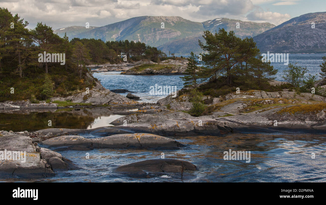 Small rock islands along the Sognefjord between Balestrand and Bergen ...