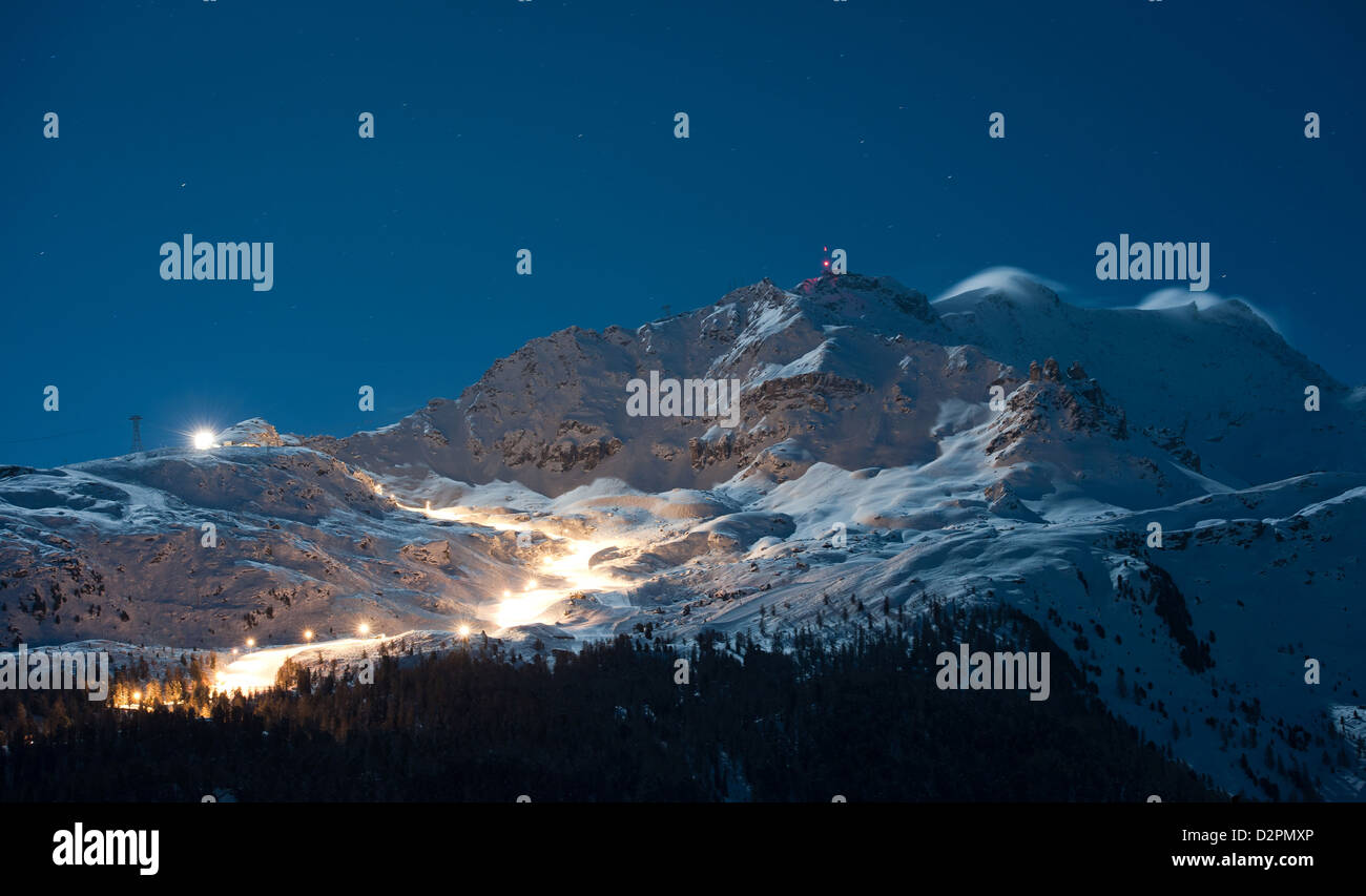 Corvatsch ski slope in St. Moritz illuminated at night, Switzerland ...