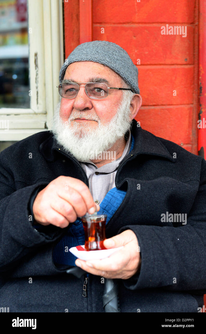 A Turkish man enjoying a cup of Turkish tea Stock Photo - Alamy
