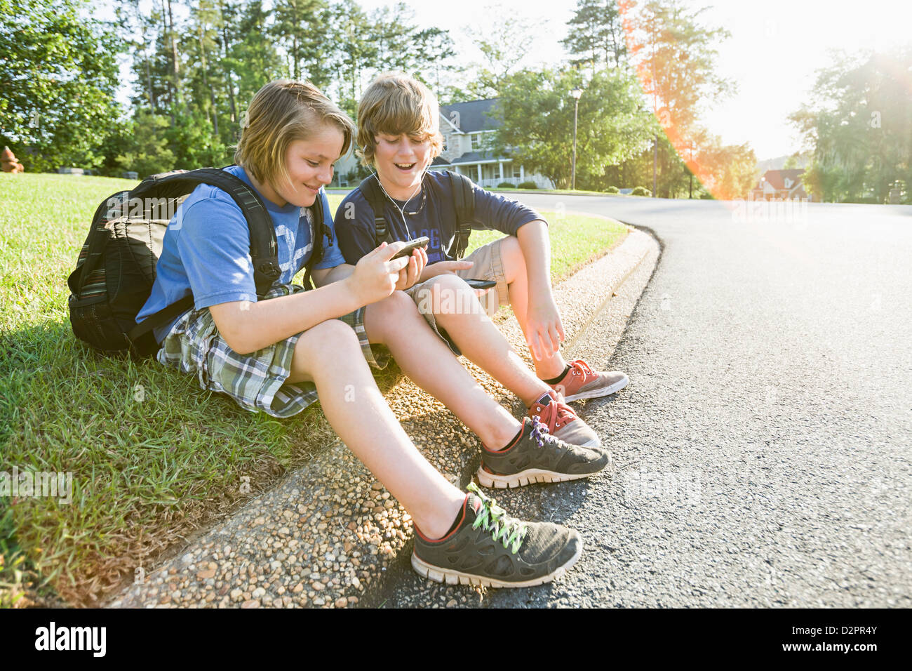 Boys text phone school hi-res stock photography and images - Alamy