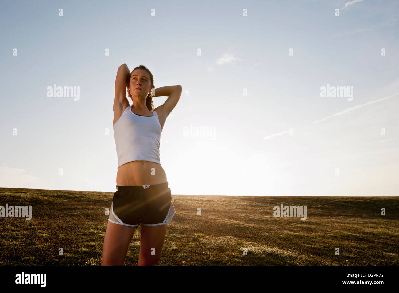 Woman runner stretching hands hi-res stock photography and images - Alamy