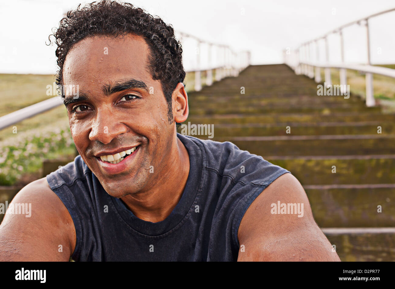 Smiling mixed race man Stock Photo - Alamy