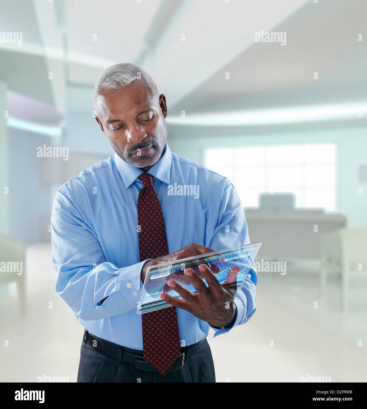 Composite image of businessman holding a tablet computer Stock Photo ...