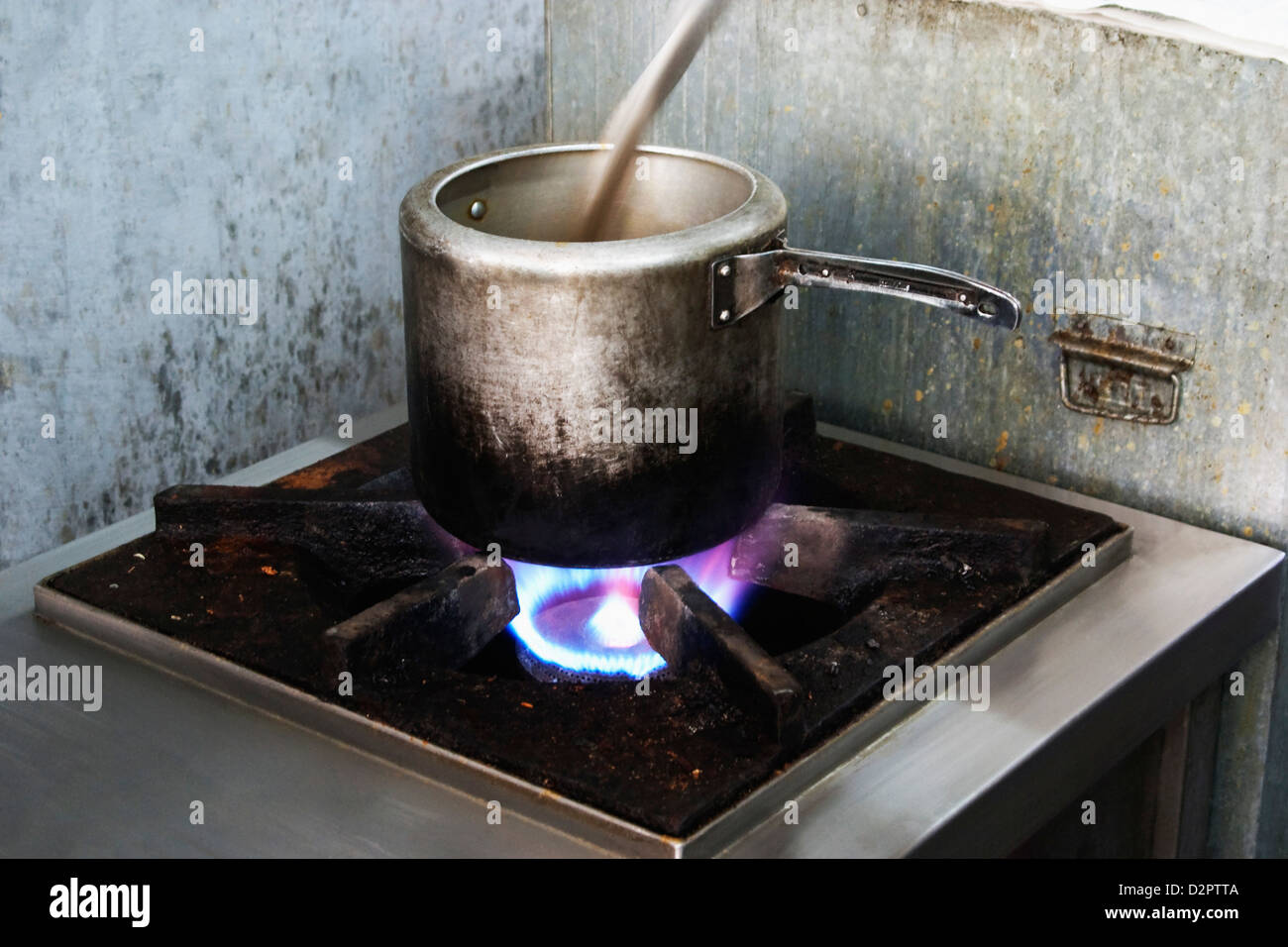 Pressure cooker on a stove Stock Photo - Alamy