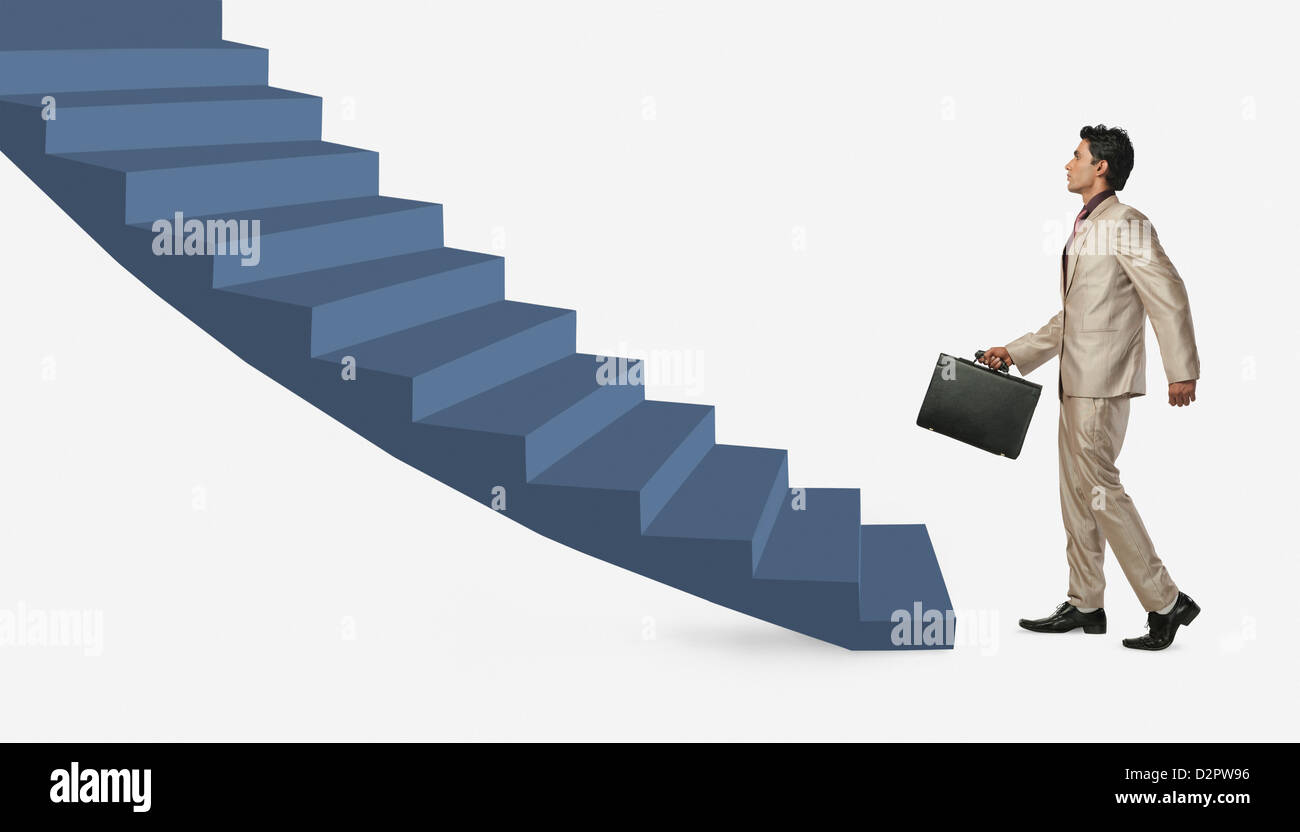 Businessman moving up staircase Stock Photo - Alamy