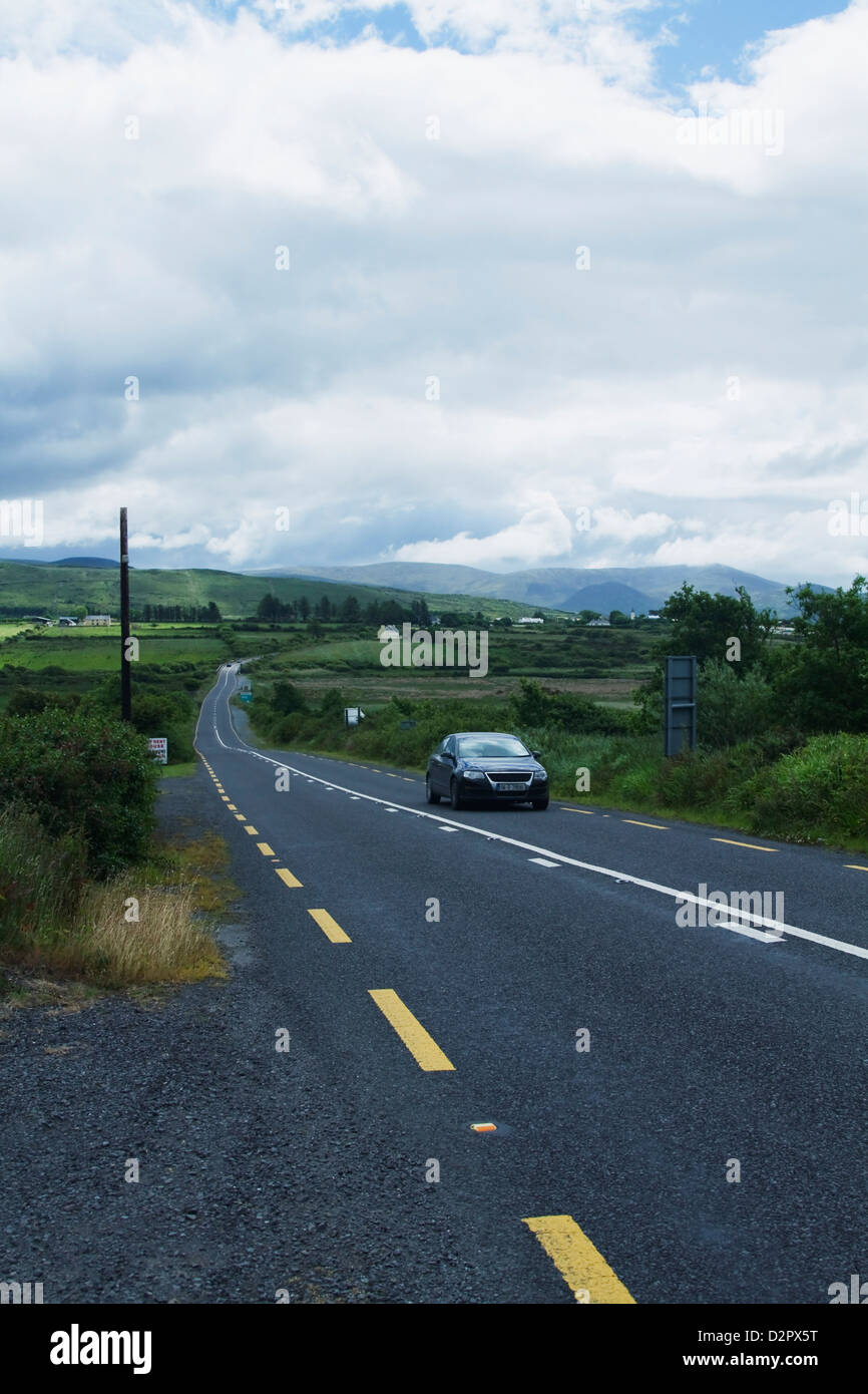 Car on the road, Ring Of Kerry, County Kerry, Republic of Ireland Stock ...