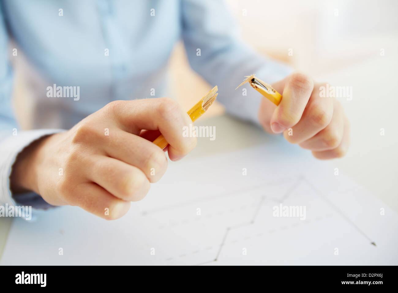 Hands breaking pencil hi-res stock photography and images - Alamy