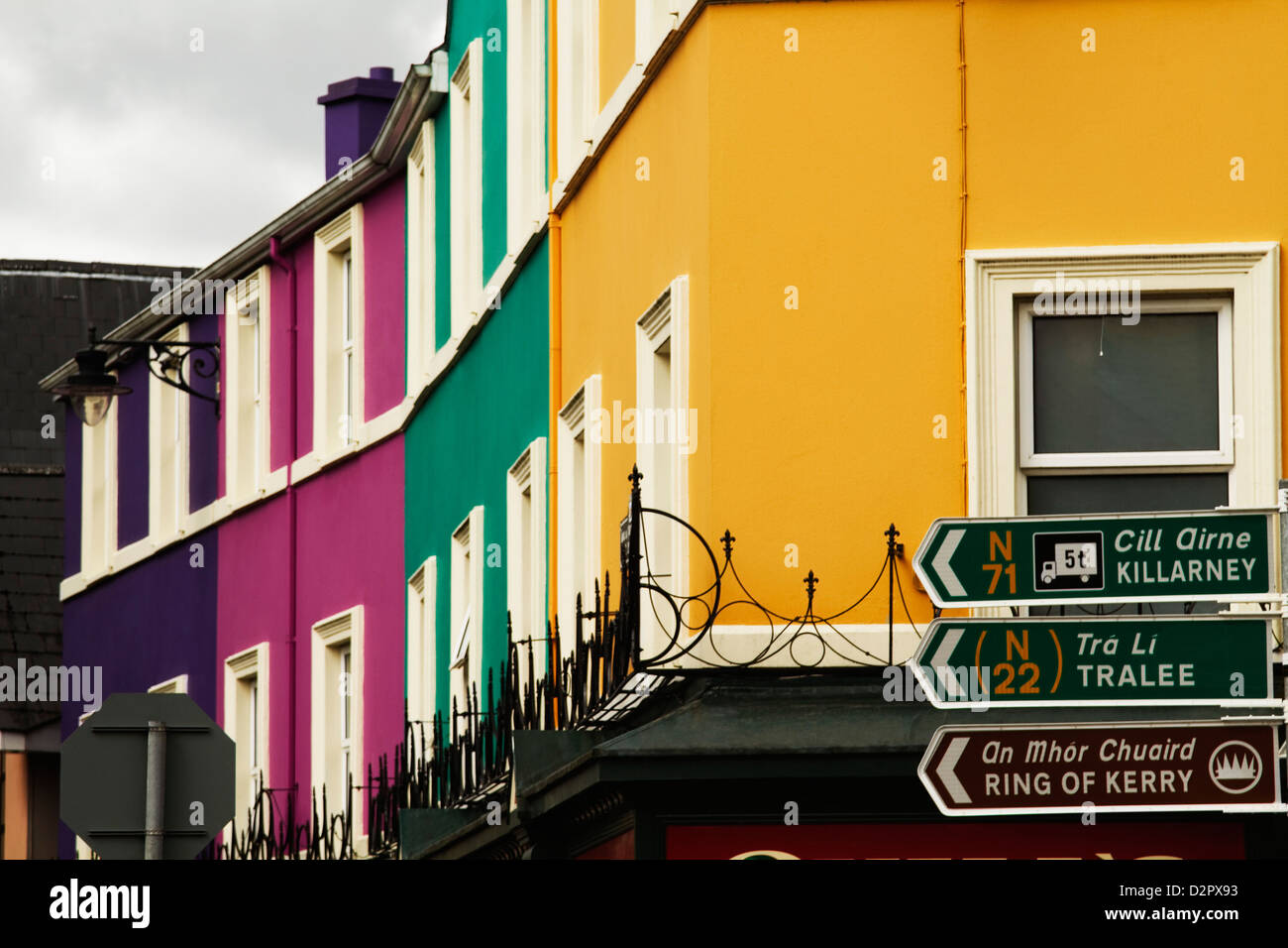 Low angle view of directional signs with buildings, Kenmare, County ...