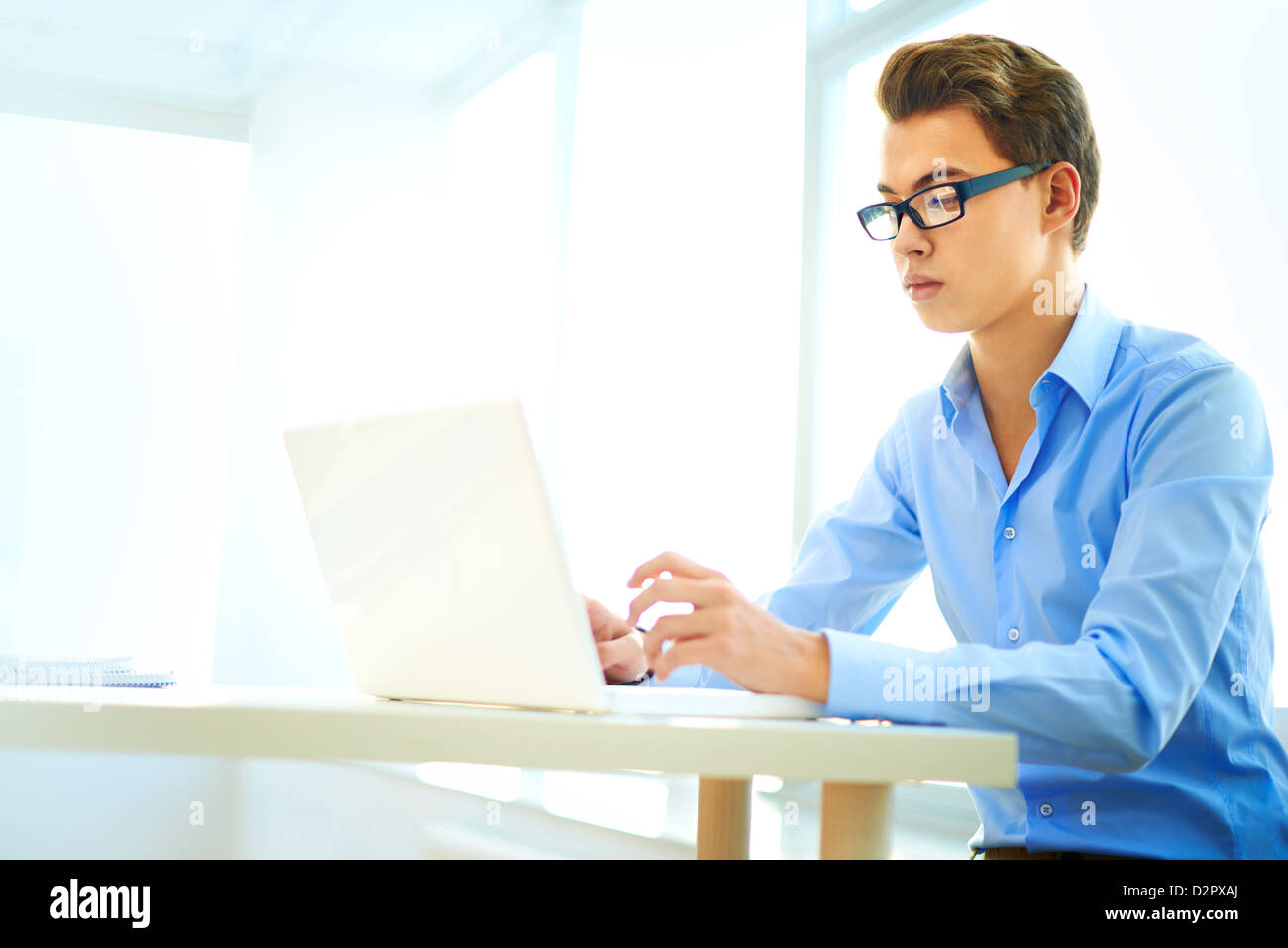 Clever business intern being busy with office work Stock Photo - Alamy