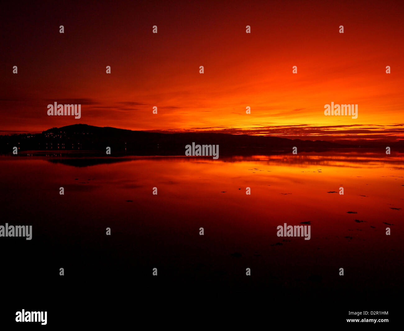 Dramatic red sunset over Inverness, looking down towards Loch Ness ...