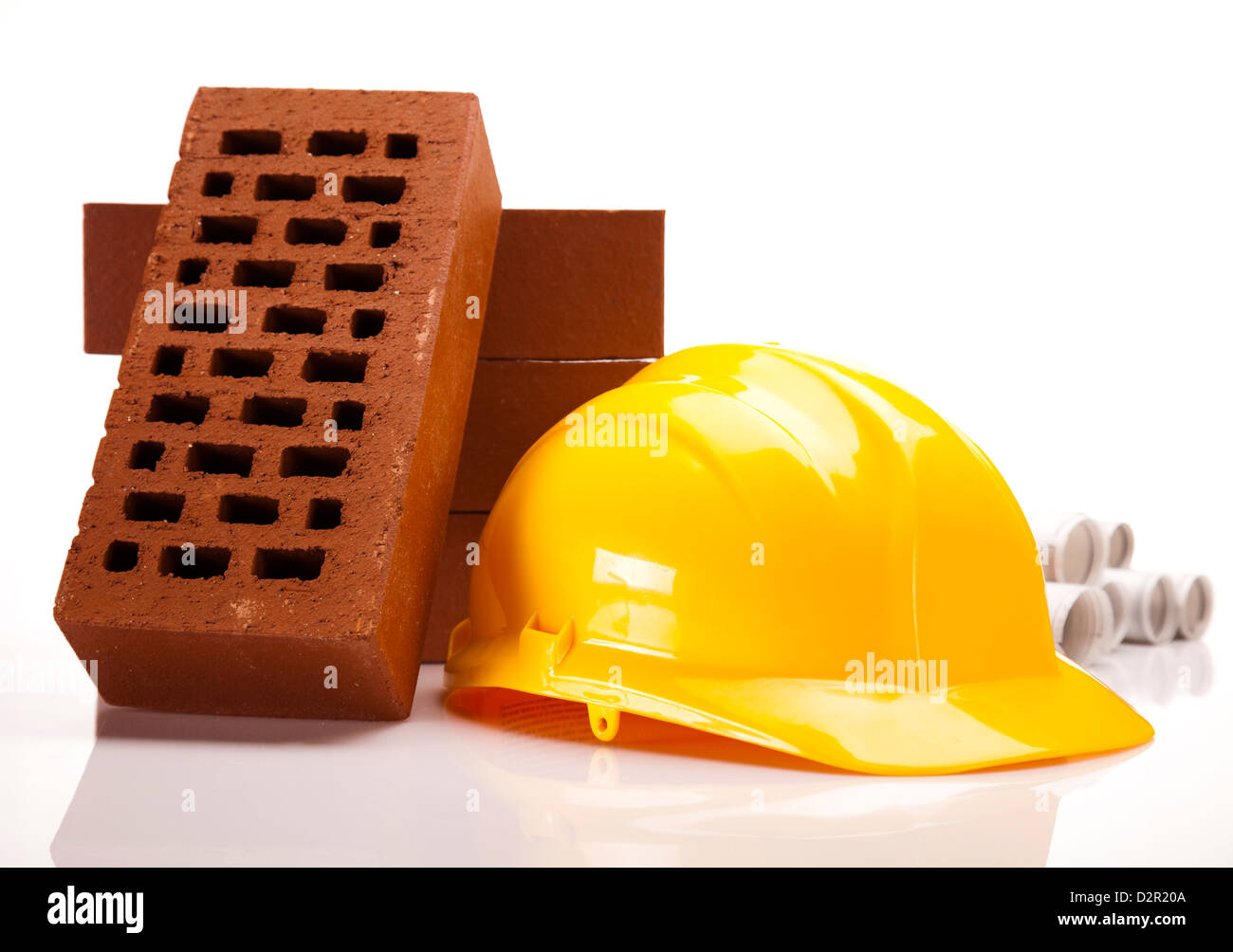 Brick,yellow hard hat,tools Stock Photo - Alamy