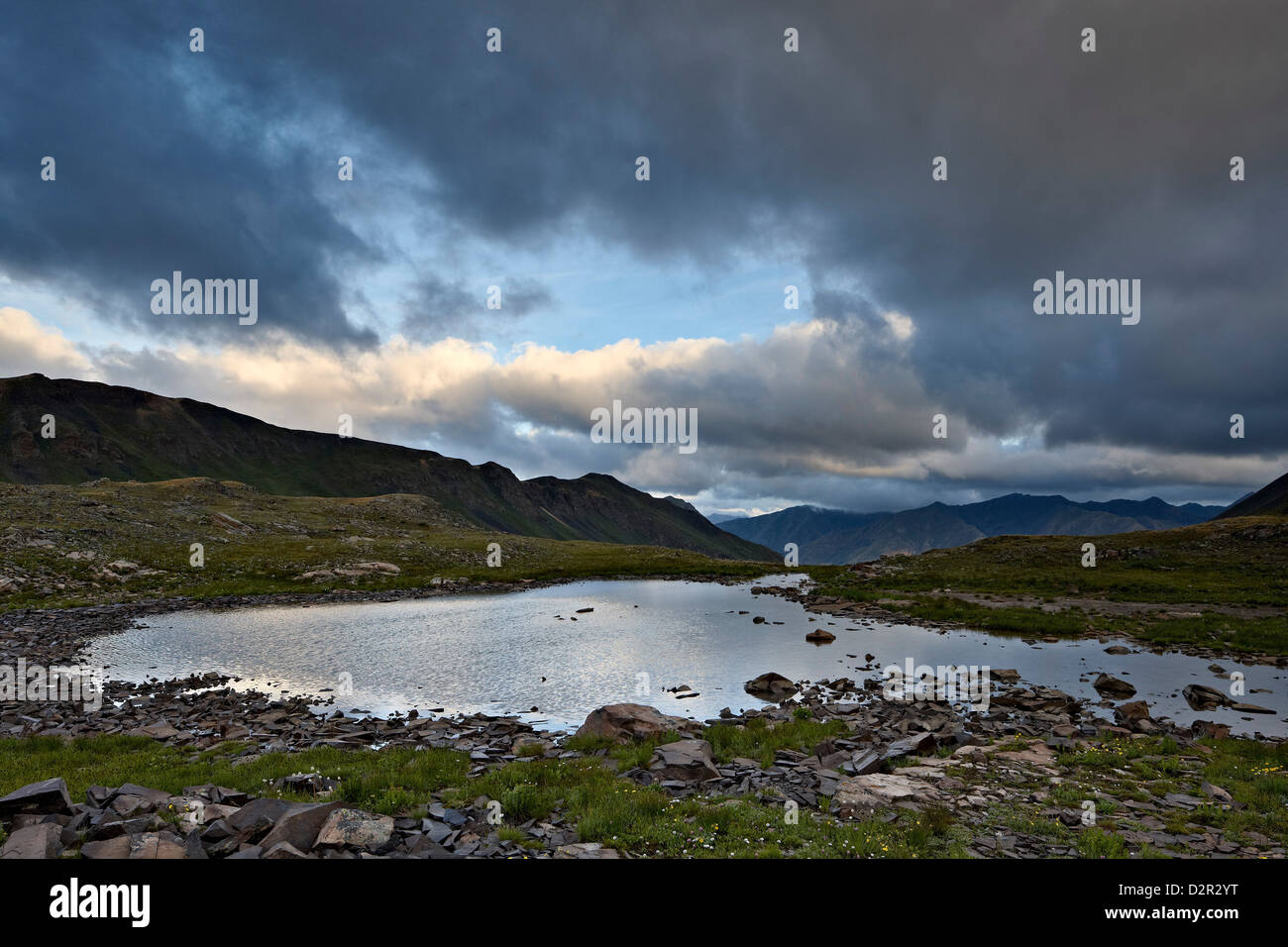 Cloudy sky above an Alpine tarn, San Juan National Forest, Colorado ...