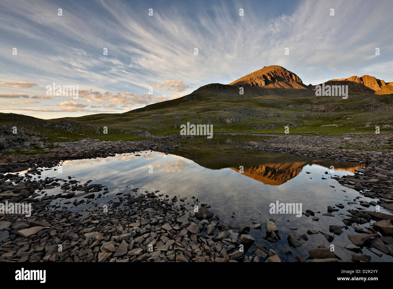 Clouds at dawn reflected in an Alpine tarn, San Juan National Forest ...