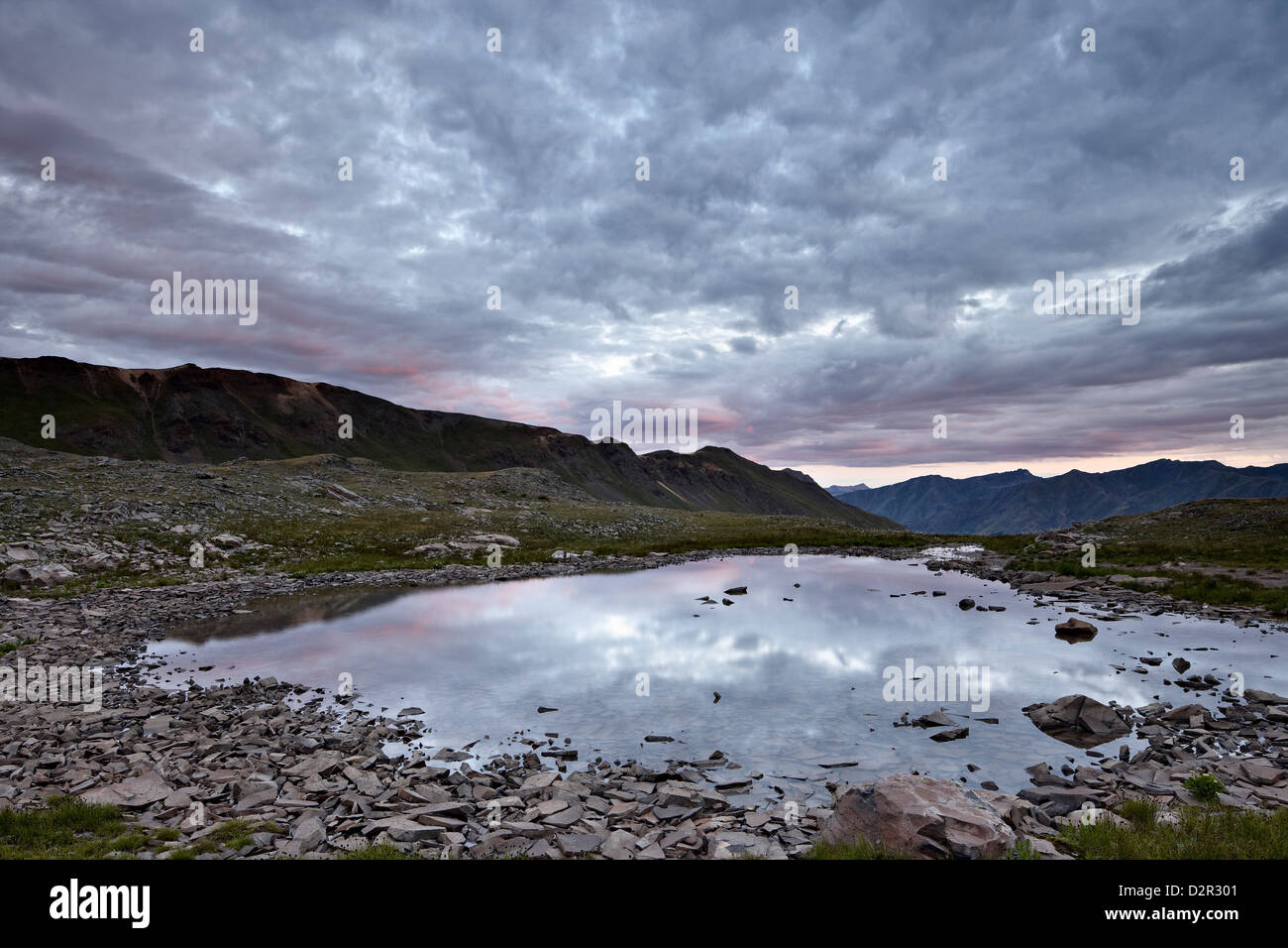 Clouds reflected in a tarn at Stony Pass, San Juan National Forest ...