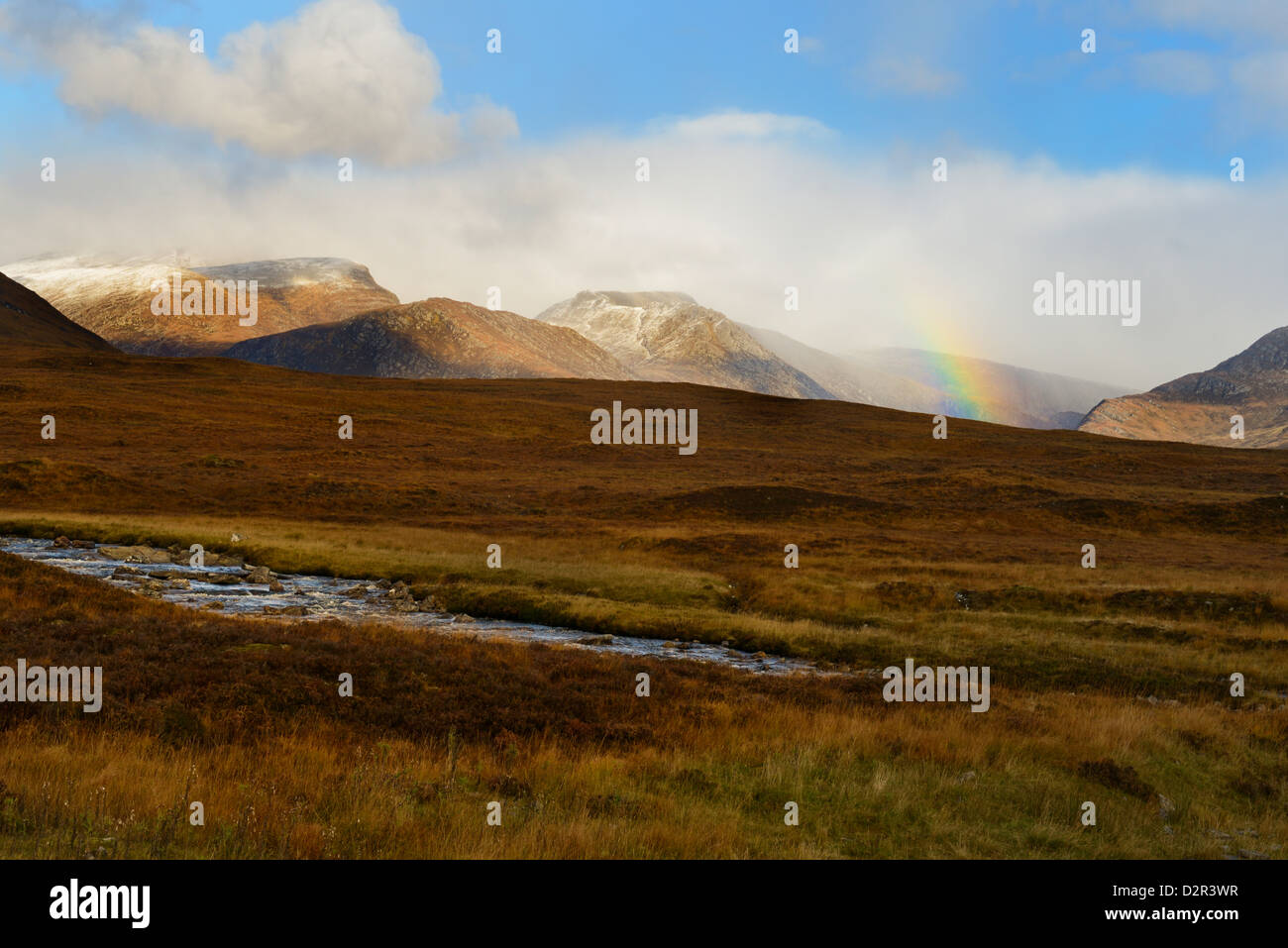 Rainbow over snow capped mountains, Highlands, Scotland, United Kingdom ...