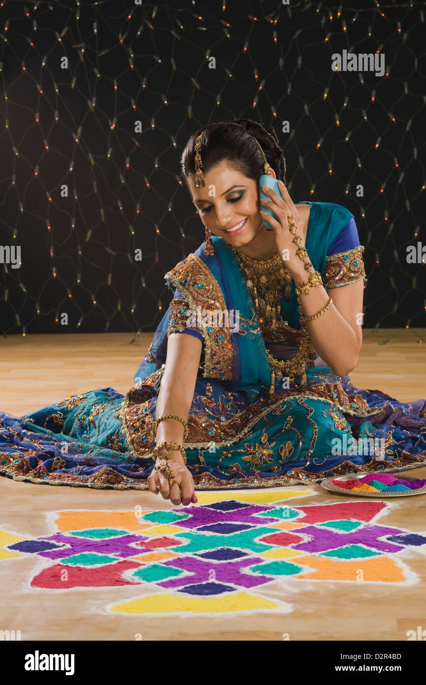 India woman making rangoli festival hi-res stock photography and images ...