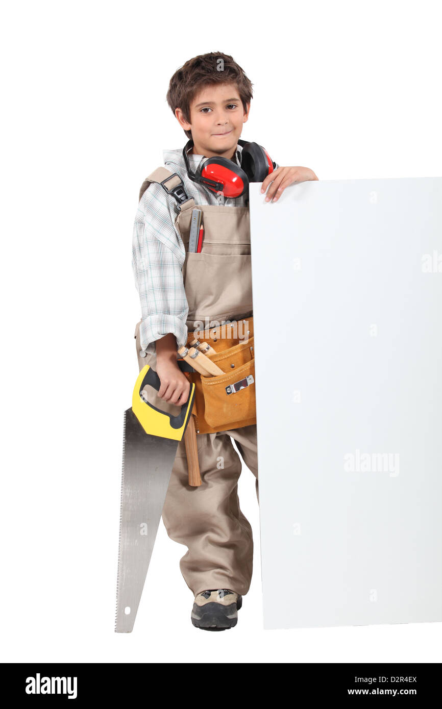 Boy builder with a board left blank for your message Stock Photo - Alamy