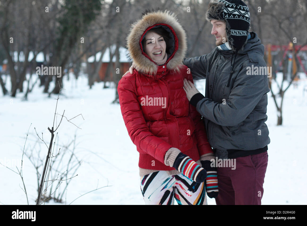 Young happy couple fun snow hi-res stock photography and images - Alamy
