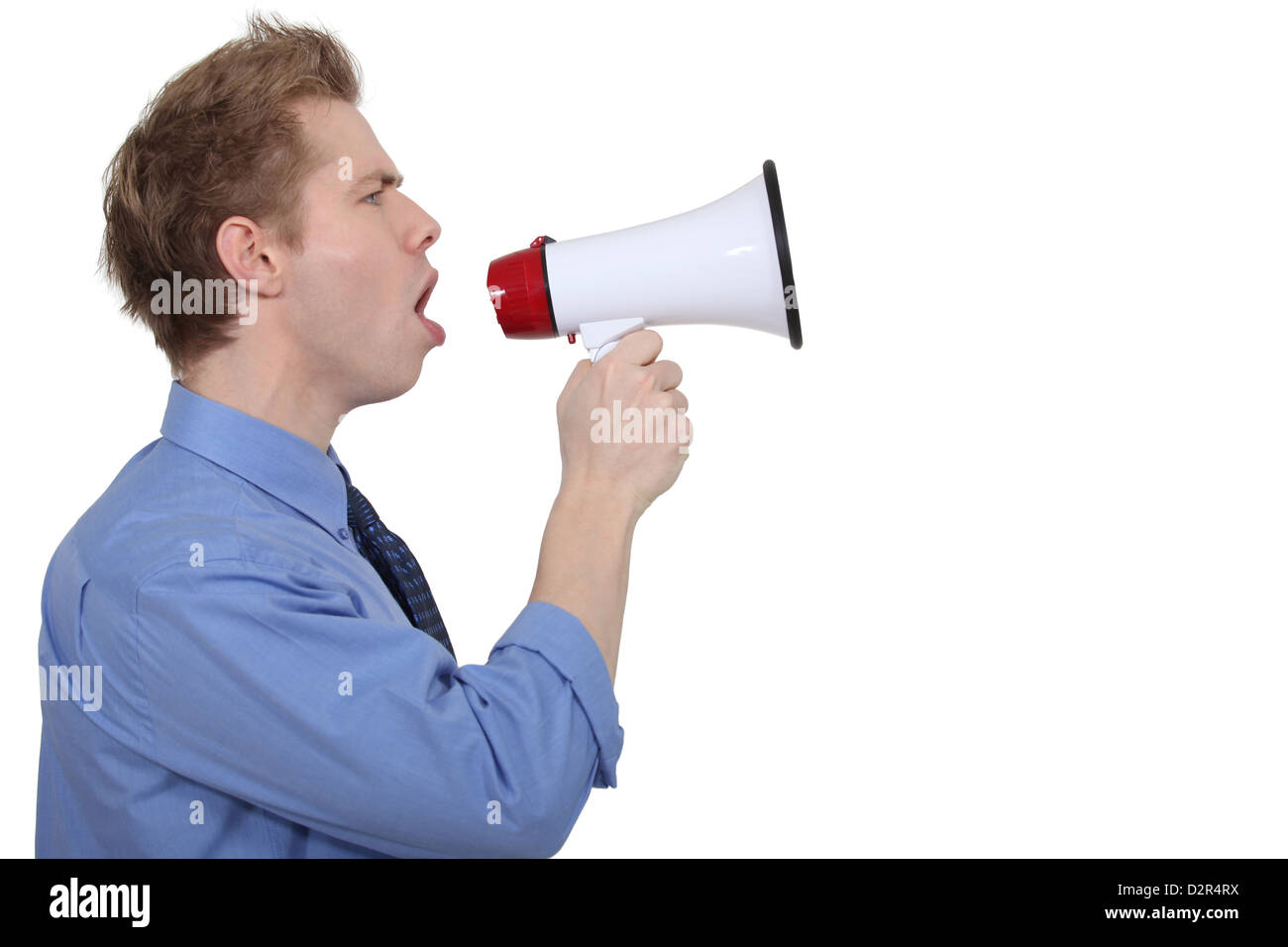 young businessman shouting in loudspeaker Stock Photo - Alamy