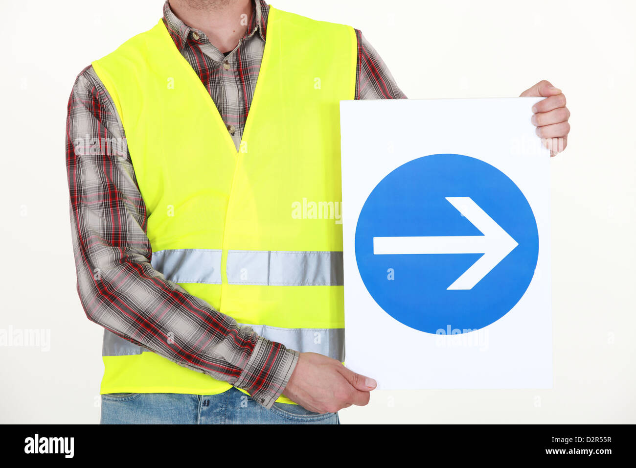 Man holding road sign Stock Photo - Alamy