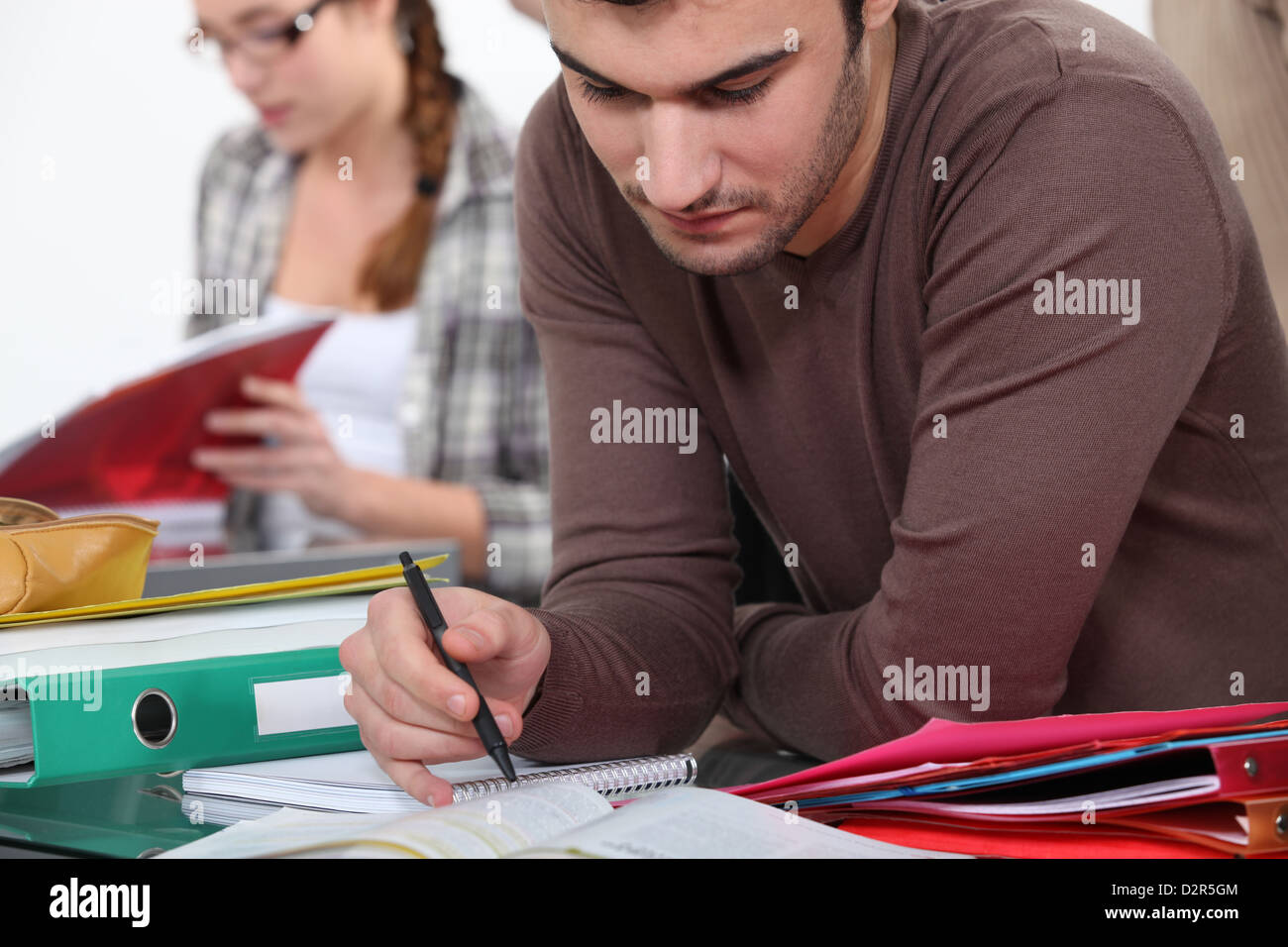 University student completing assigned reading Stock Photo - Alamy