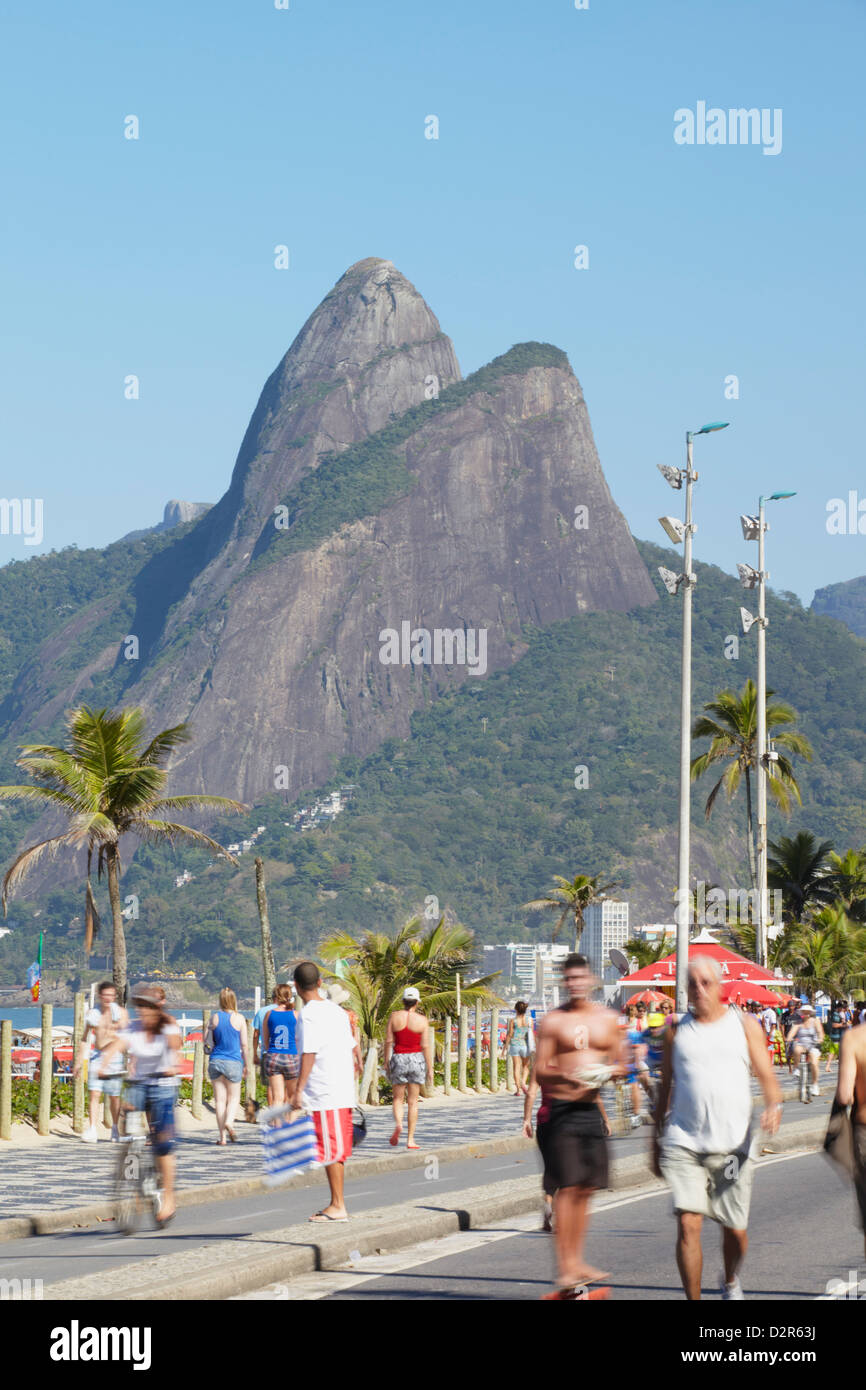 People cycling and walking along pedestrianised street on Sunday ...
