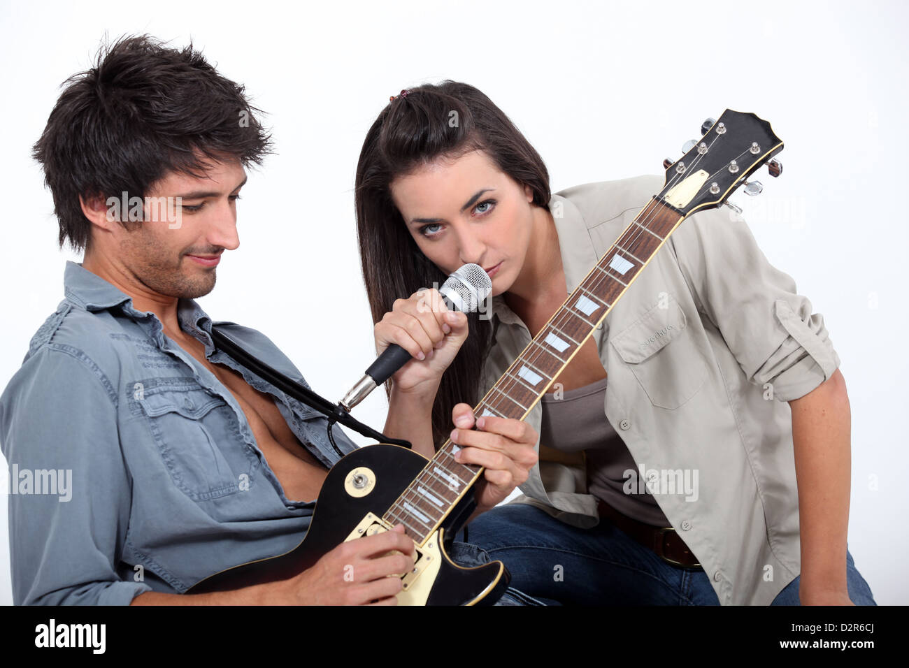 Couple playing music Stock Photo - Alamy