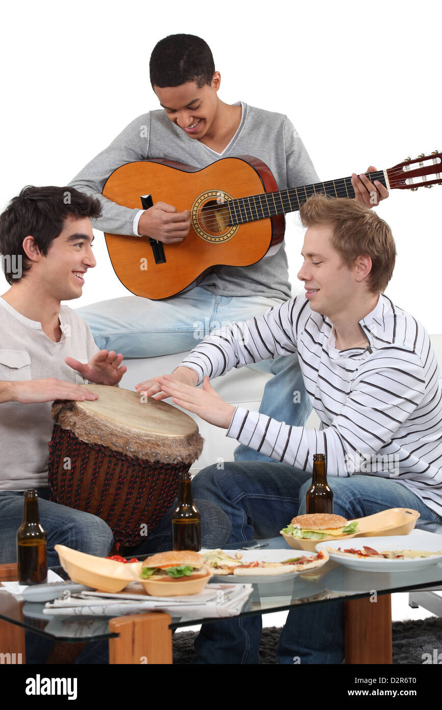 Three attractive young musicians playing hi-res stock photography and ...